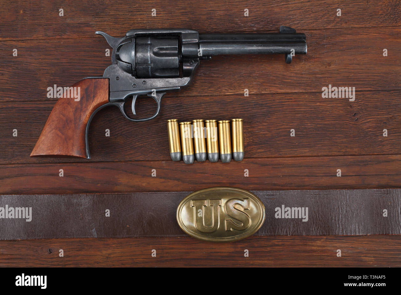 Old revolver with cartridges and U.S. Army soldier's belt with a buckle ...