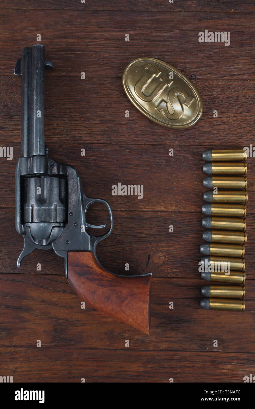 Old revolver with cartridges and U.S. Army soldier's belt with a buckle ...