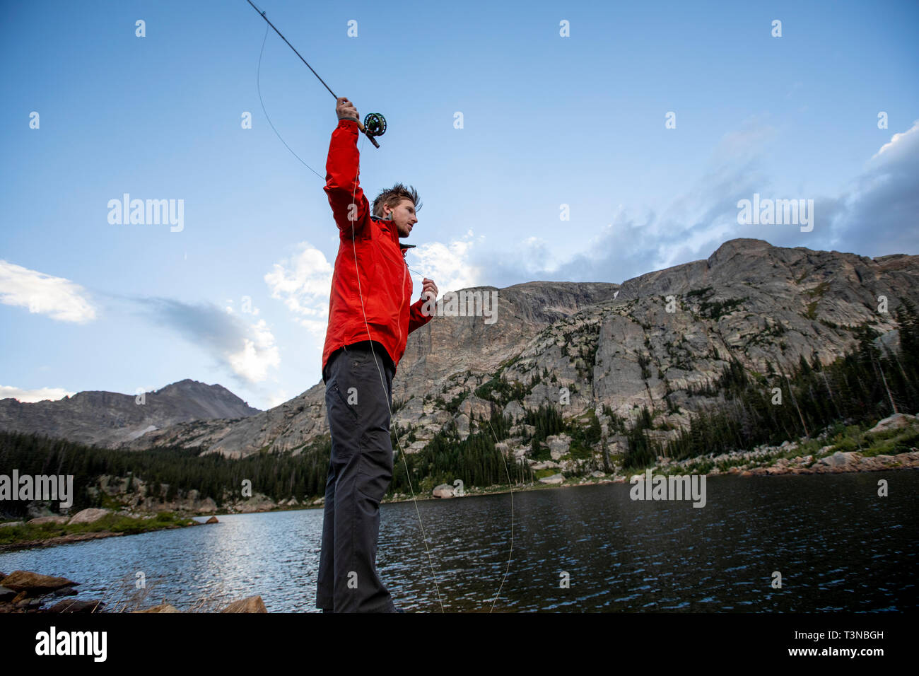 Fly fisherman fishing Pear Lake in Rocky Mountain National Park Stock ...