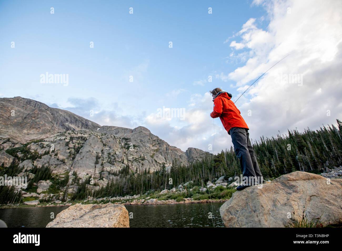 Fly fisherman fishing Pear Lake in Rocky Mountain National Park Stock ...