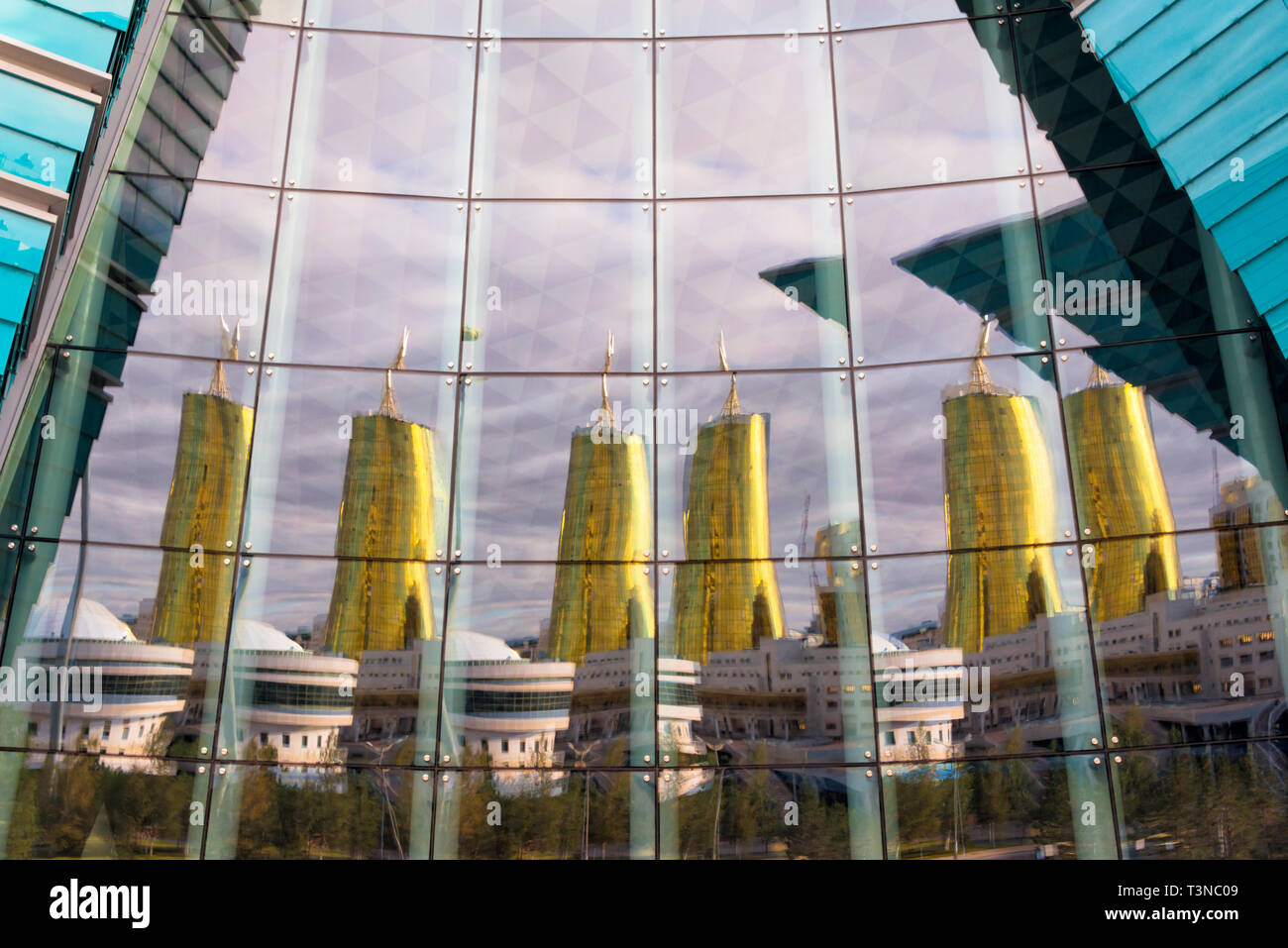 Reflection of the Golden Towers in the glass exterior of Kazakhstan ...