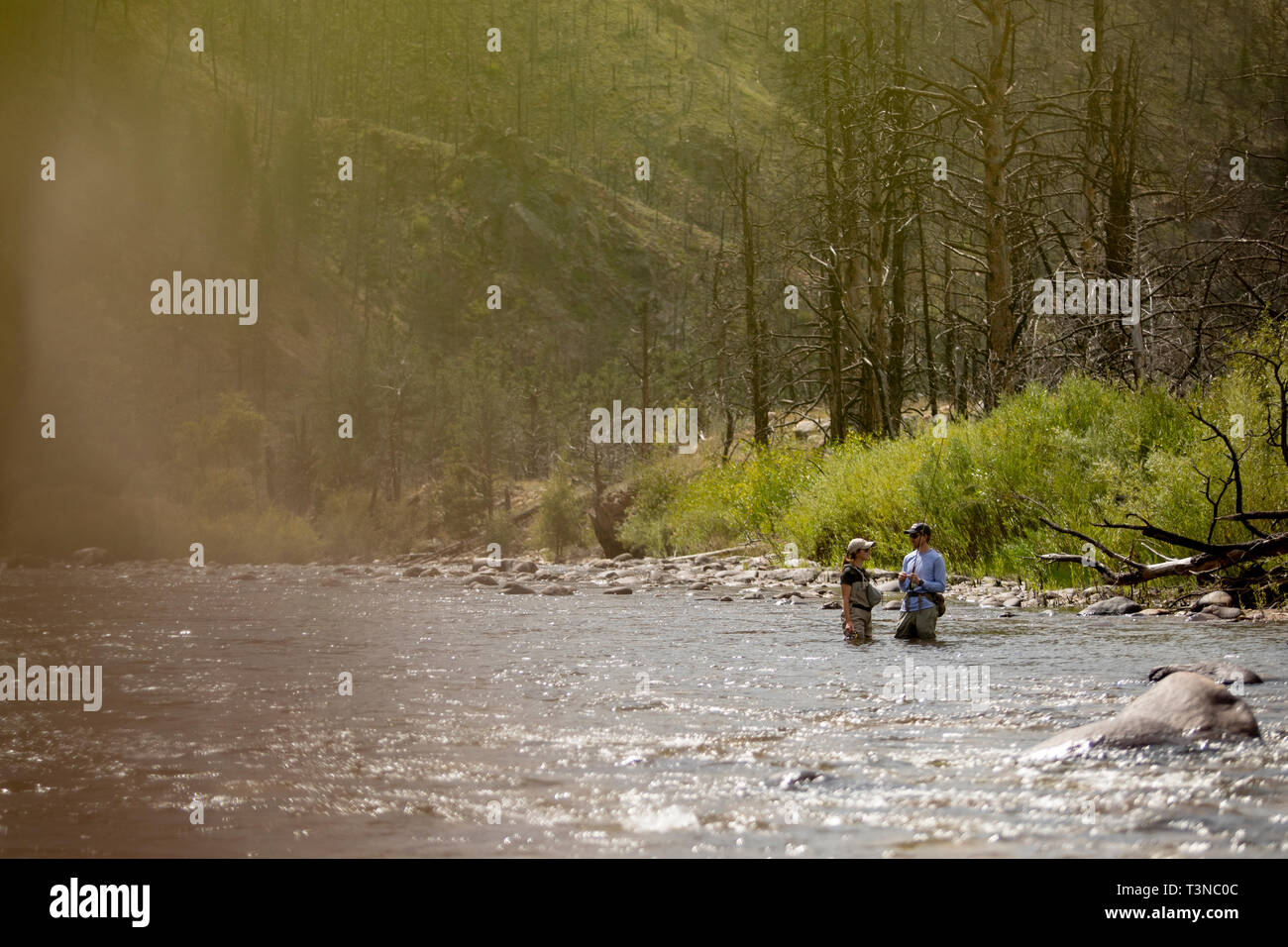 Husband and wife fly fishing Stock Photo - Alamy