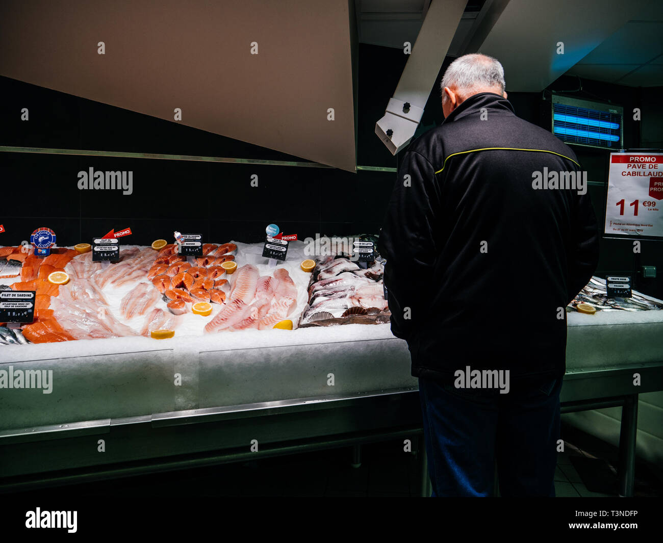 Young woman releases fish in hi-res stock photography and images - Alamy