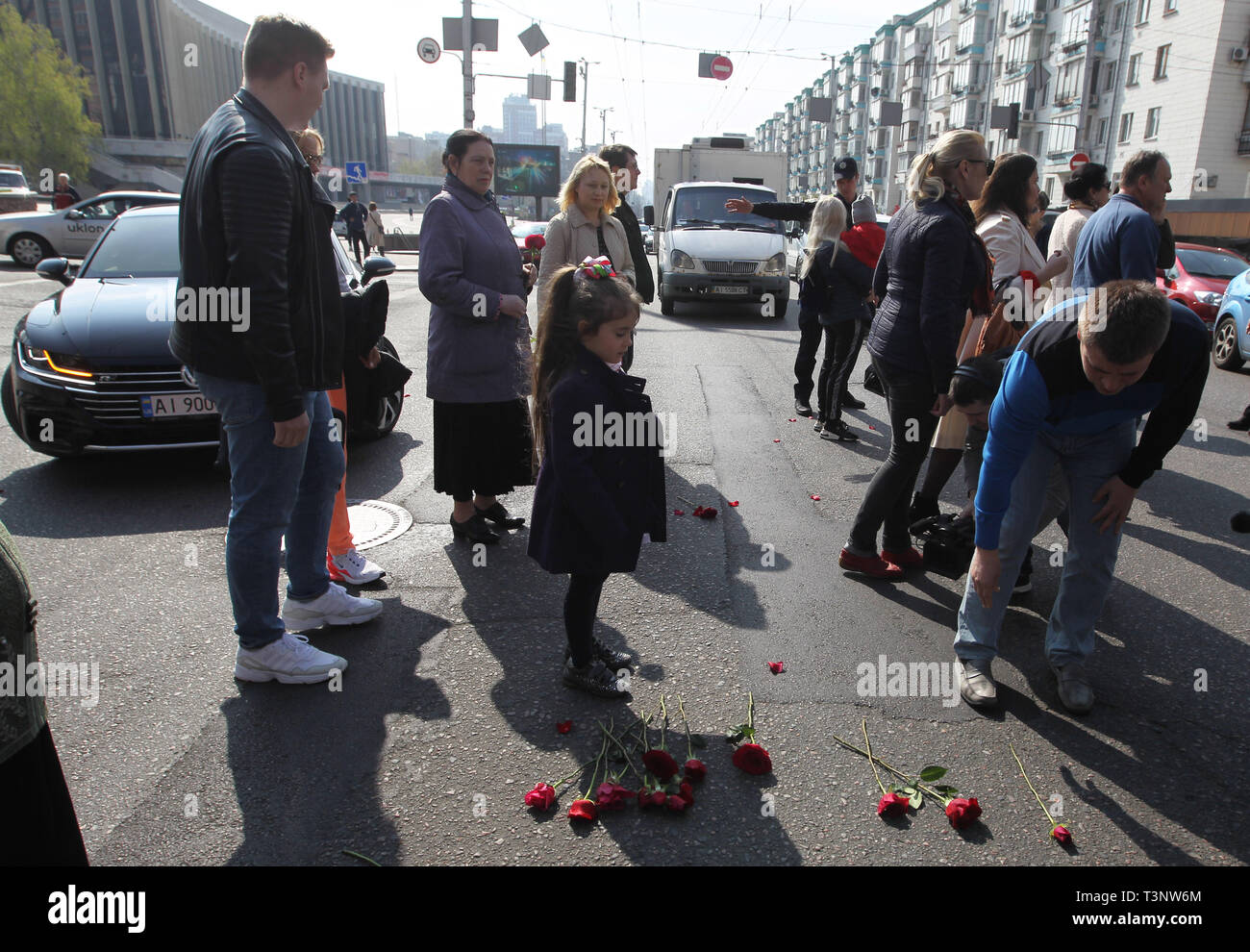 Flowers seen laying in the middle of the road while protesters watch on ...