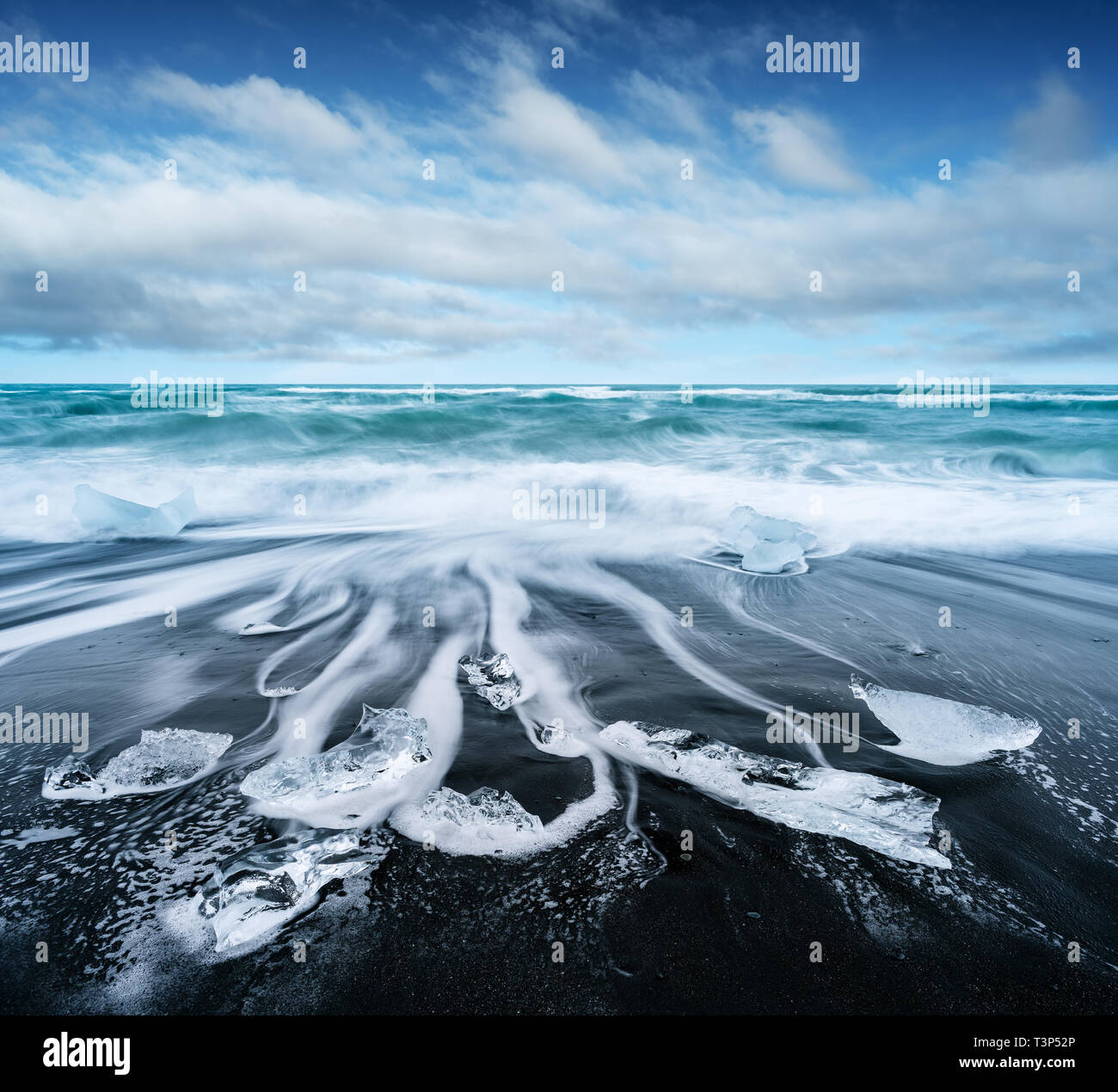 Icy beach in Iceland, Europe. Ice on the black volcanic sand on the ...
