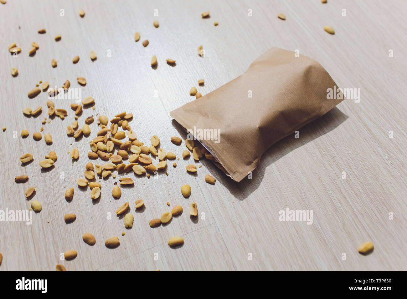Spilled brown bag of peanuts in shells Stock Photo - Alamy
