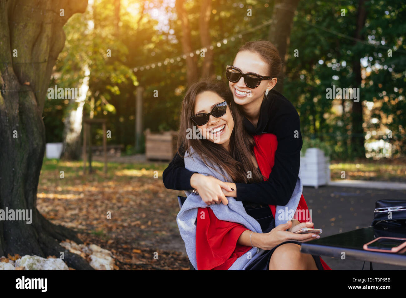 Girl hugging her friend. Portrait Two girlfriends in the park Stock ...