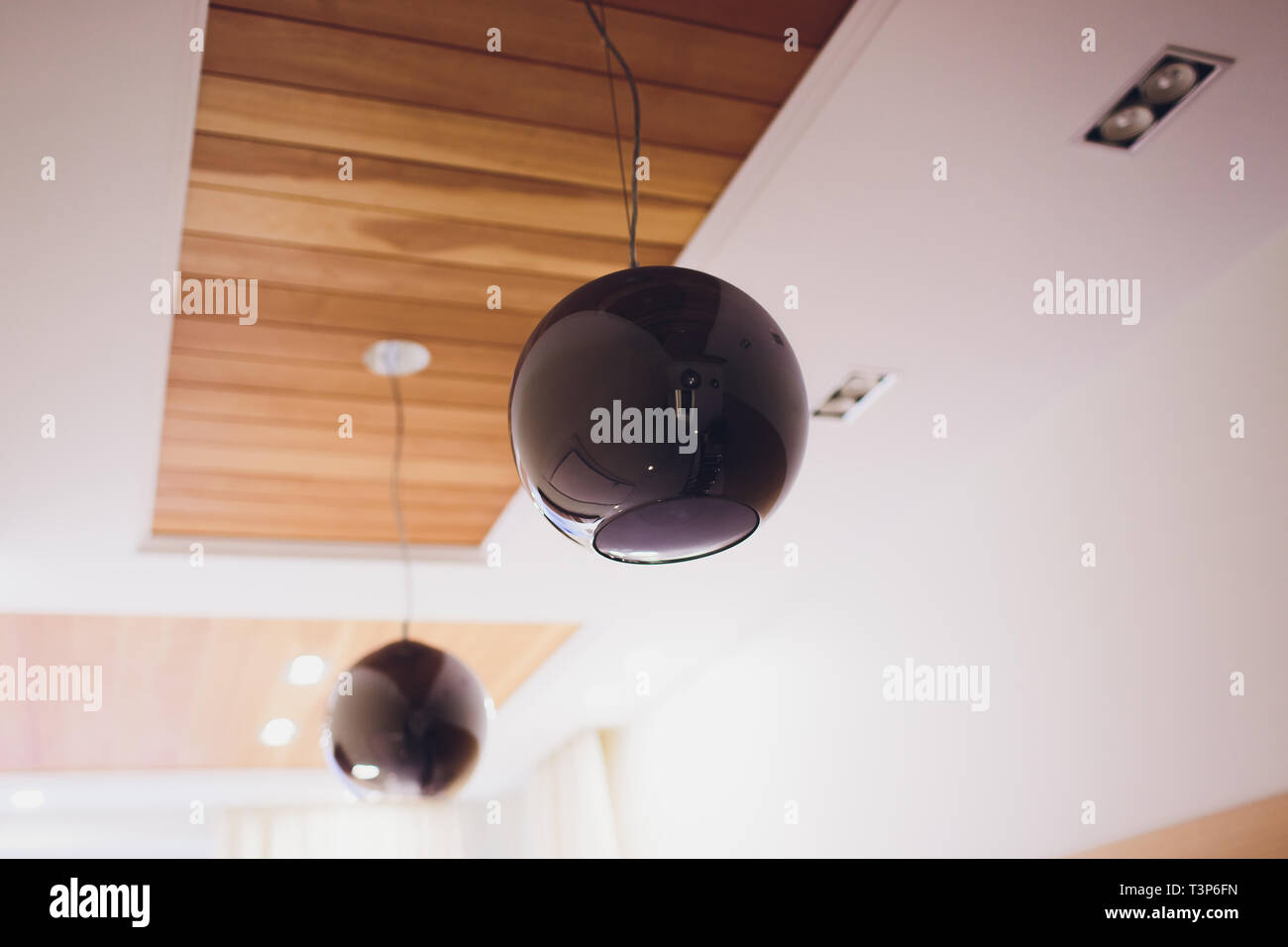 lamp in the interior, black round lamp Stock Photo - Alamy