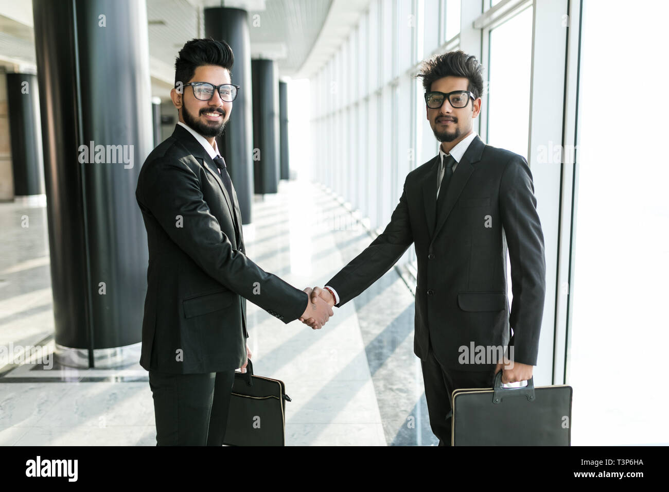 Side view two business men table face face hi-res stock photography and ...