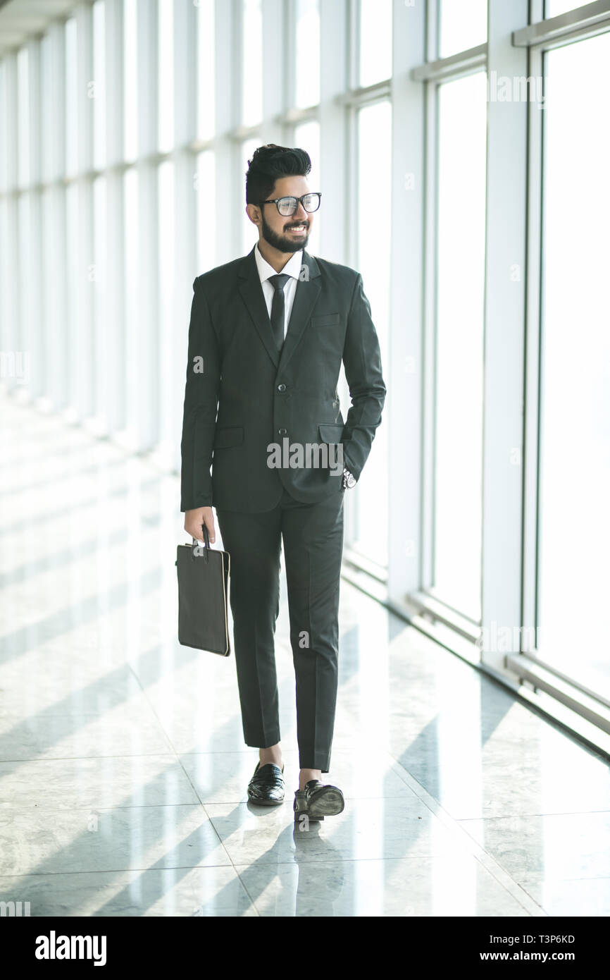 Indian businessman walking hi-res stock photography and images - Alamy