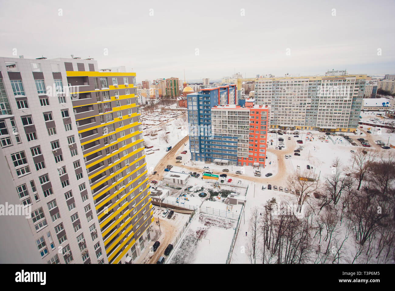 Construction of high-rise residential buildings in the big city. Winter ...