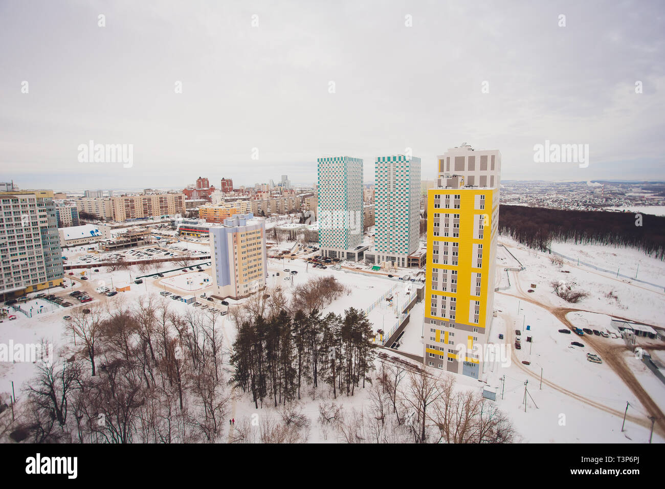 Construction of high-rise residential buildings in the big city. Winter ...