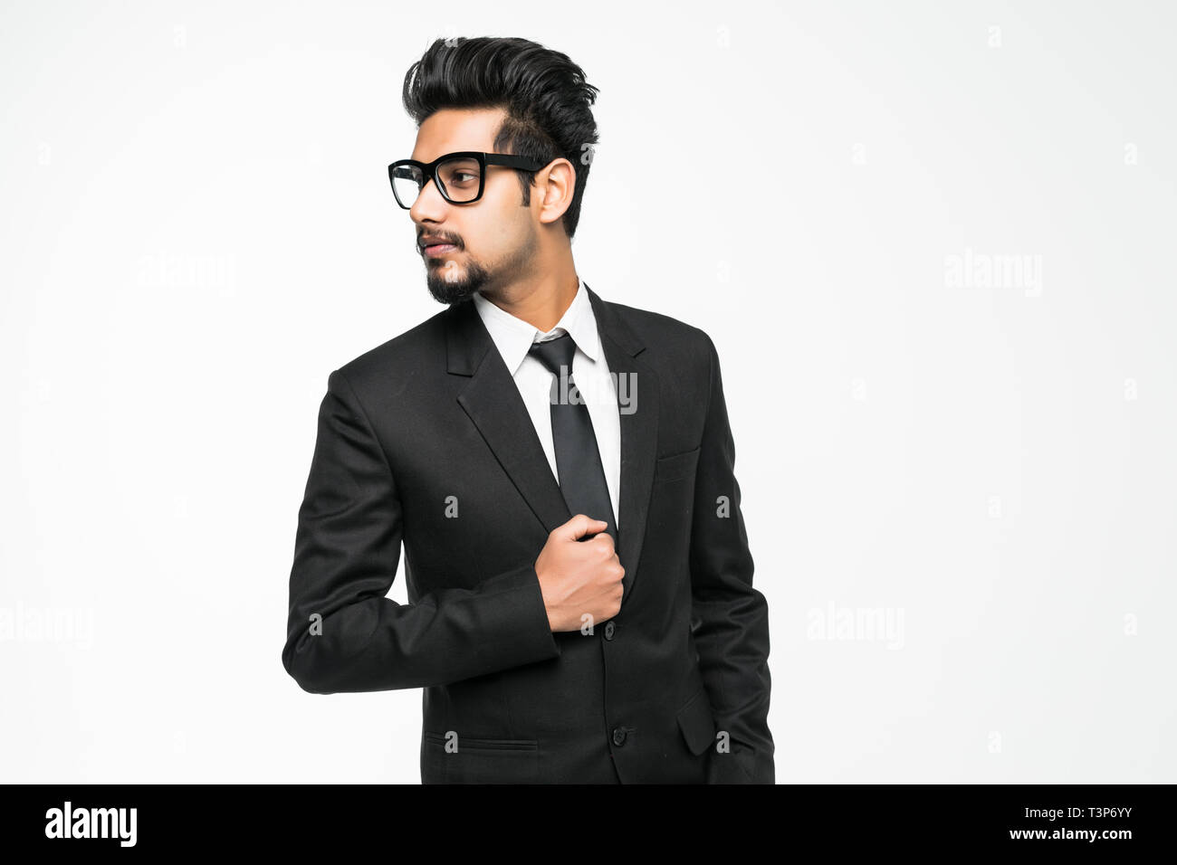 Handsome indian man in glasses standing against on white background ...