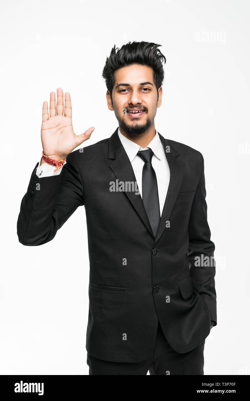 Young indian businessman shows his hand hello isolated white background ...