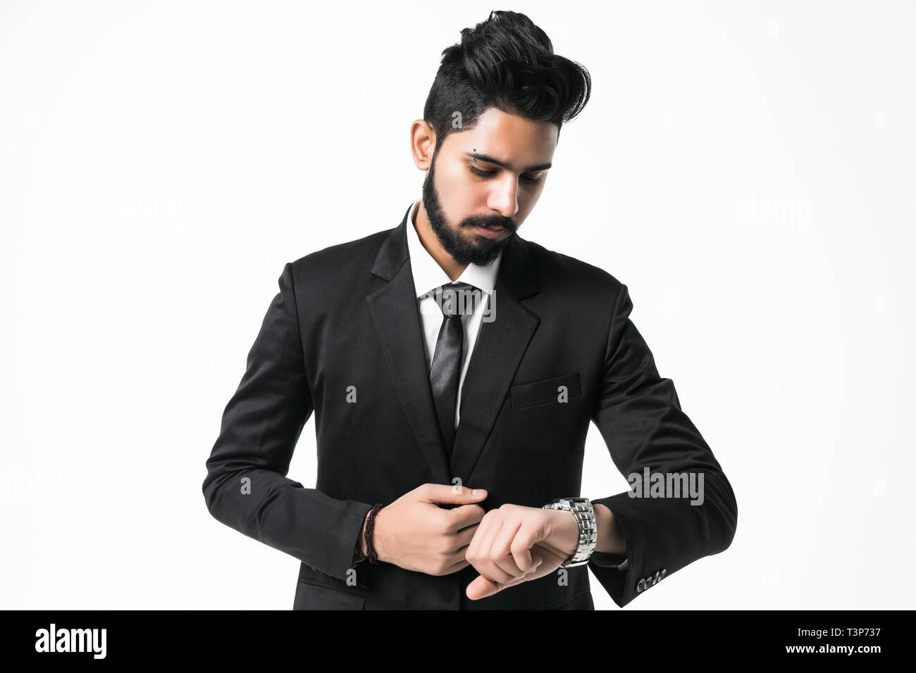 young business man looking at watch over white background Stock Photo ...