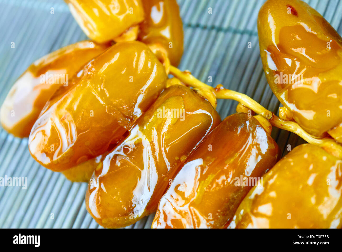 Sweet arabic algerian dates fruits on a wooden floor Stock Photo - Alamy
