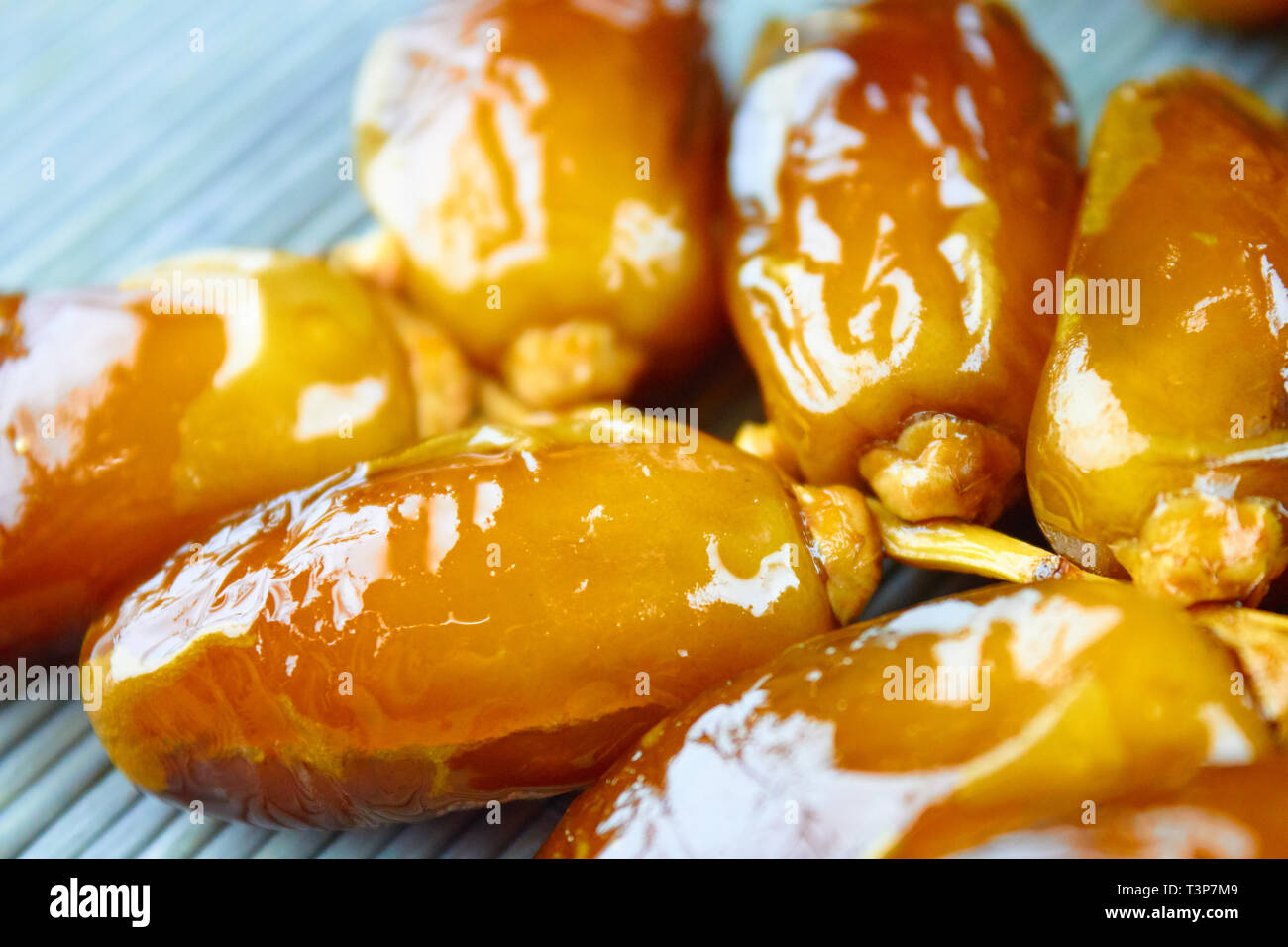 Sweet arabic algerian dates fruits on a wooden floor Stock Photo - Alamy