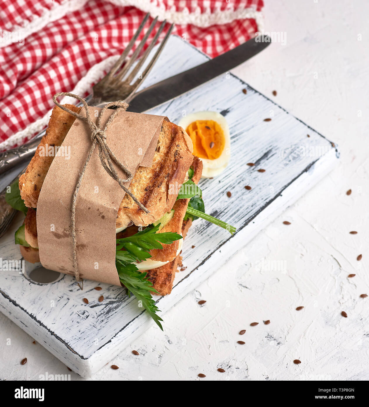 sandwich from square pieces of toasted bread, vegetables and boiled ...