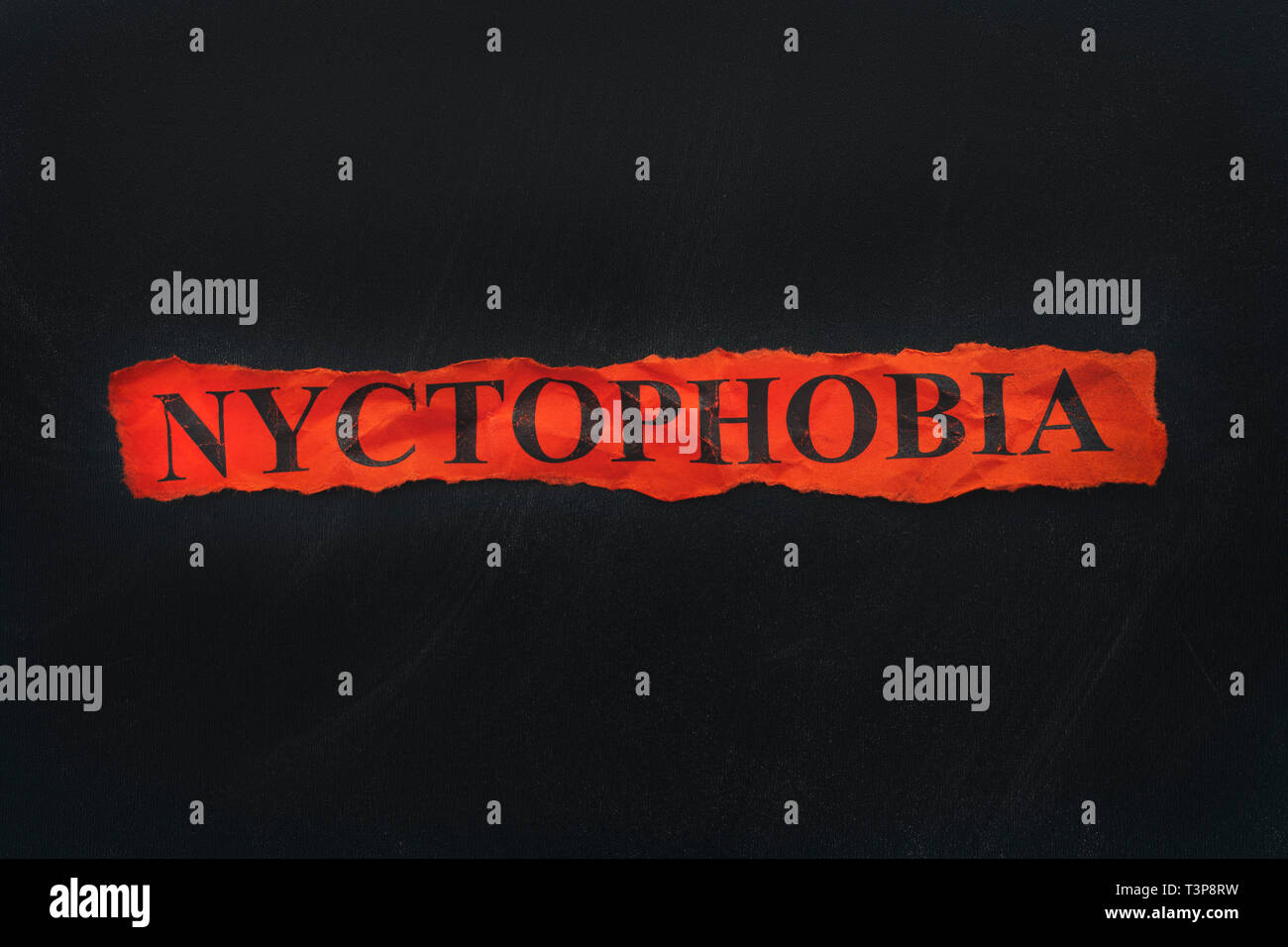 Word Nyctophobia on red torn piece of paper. Nyctophobia (Scotophobia ...
