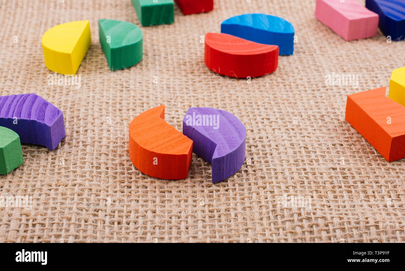 Colorful wooden pieces of a logic puzzle Stock Photo - Alamy