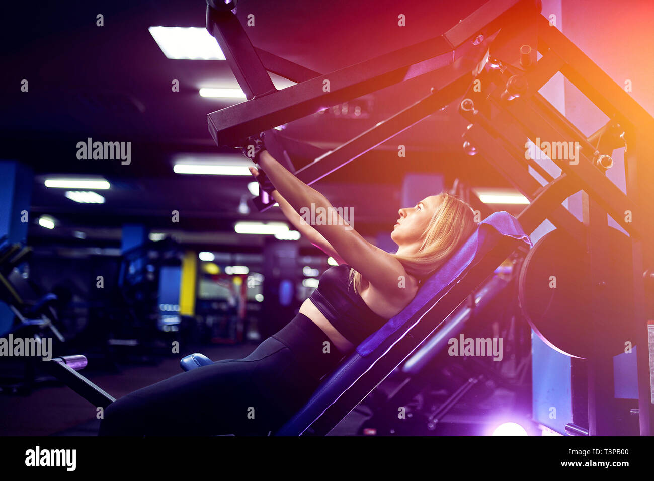 Attractive fit middle age woman athlete doing exercises on pectoral ...