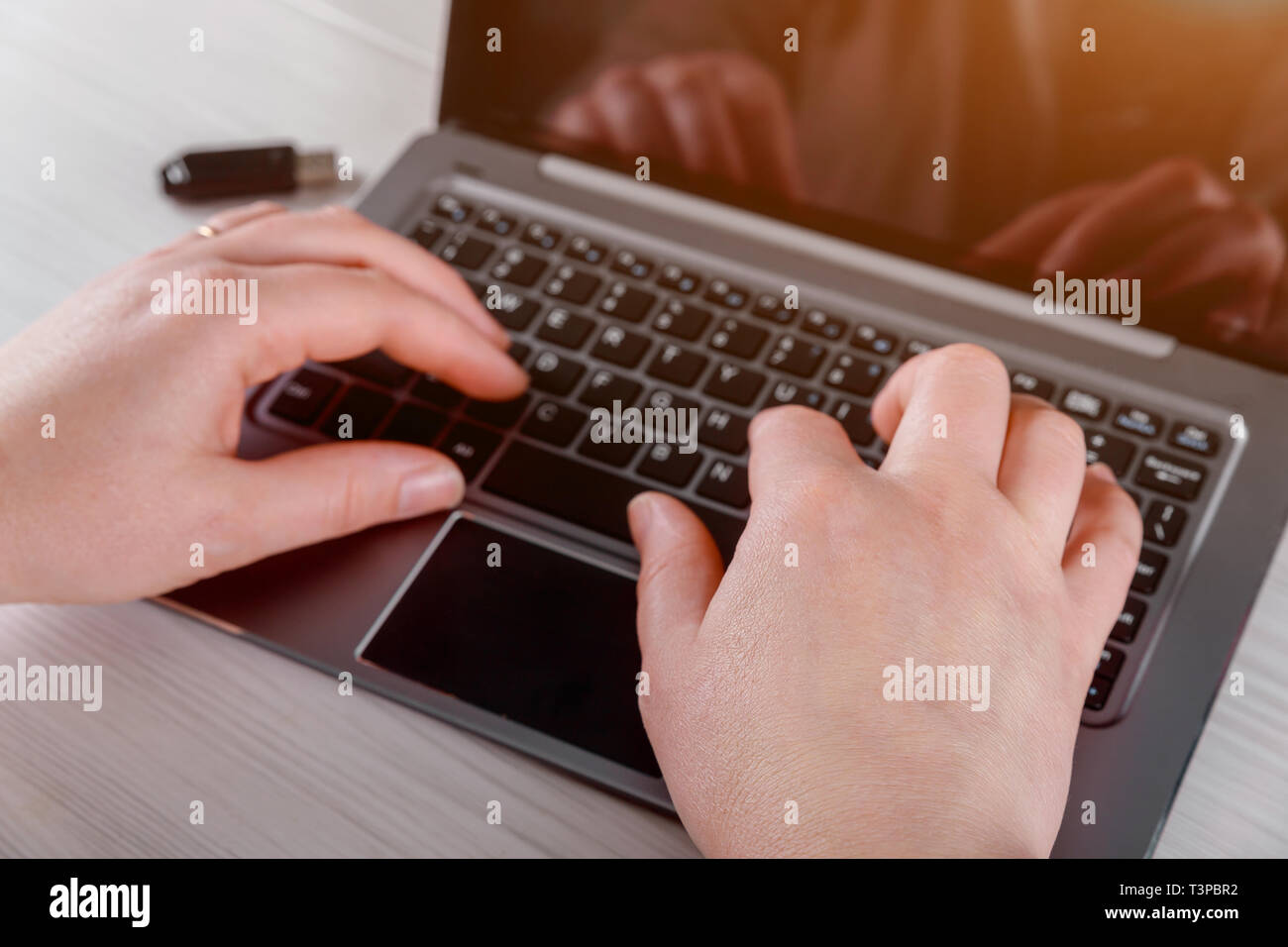 Closeup woman hand using laptop with modern office Stock Photo - Alamy