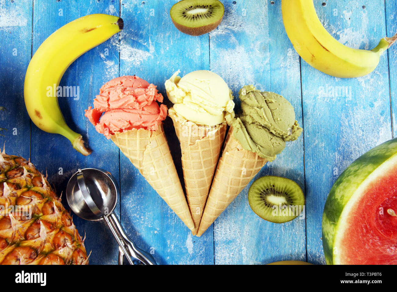 Set of ice cream scoops of different colors and flavours with berries ...
