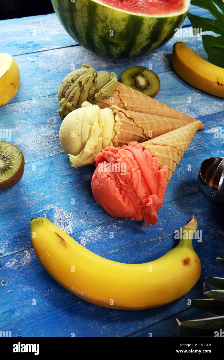 Set of ice cream scoops of different colors and flavours with berries ...