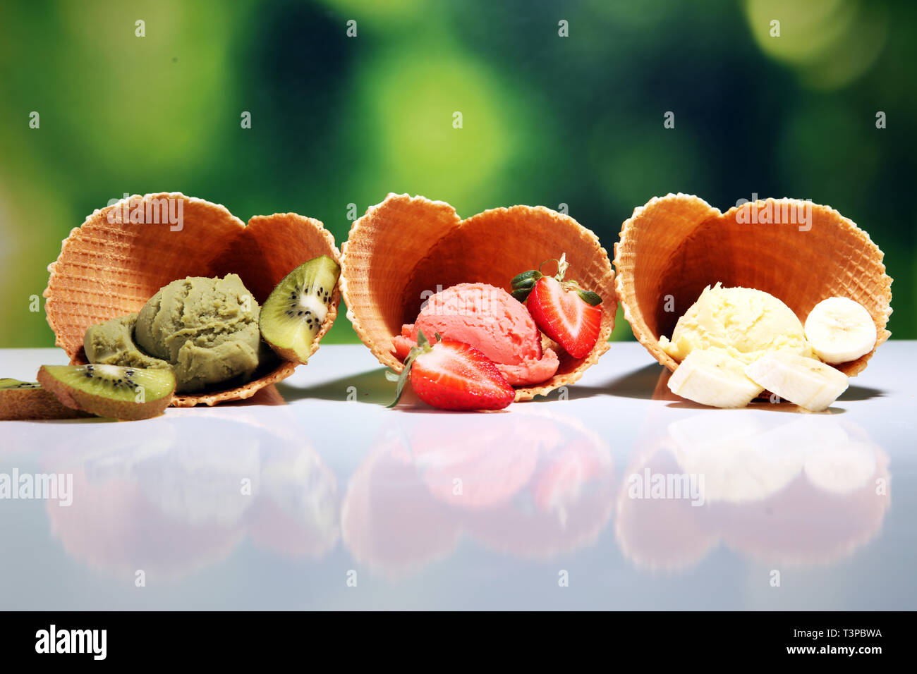 Set of ice cream scoops of different colors and flavours with berries ...