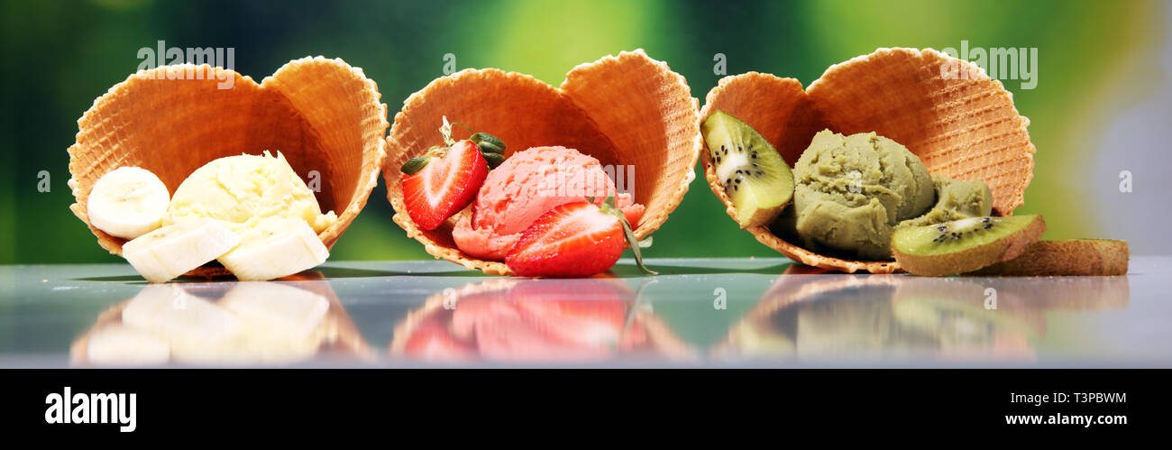 Set of ice cream scoops of different colors and flavours with berries ...