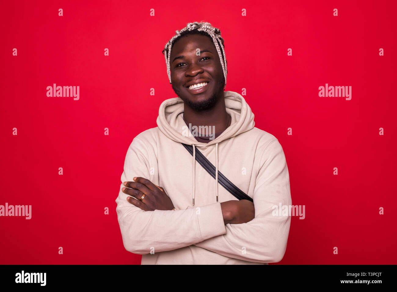 Portrait of handsome man isolated on a red background Stock Photo - Alamy