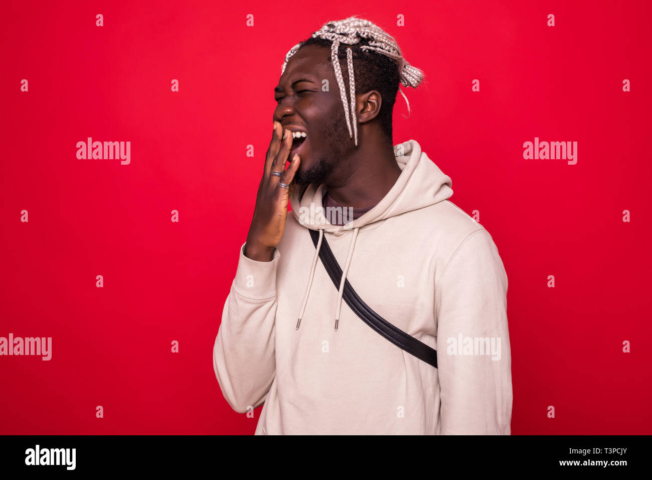 Closeup portrait of handsome tired fatigued man stretching arms, back ...