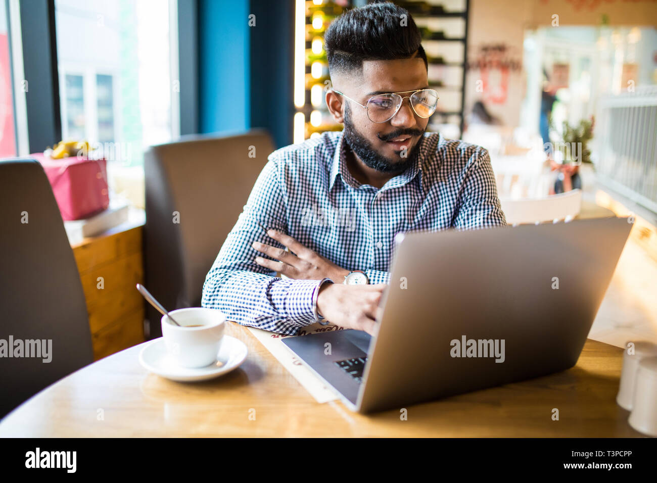 Indian man coffee, laptop hi-res stock photography and images - Alamy
