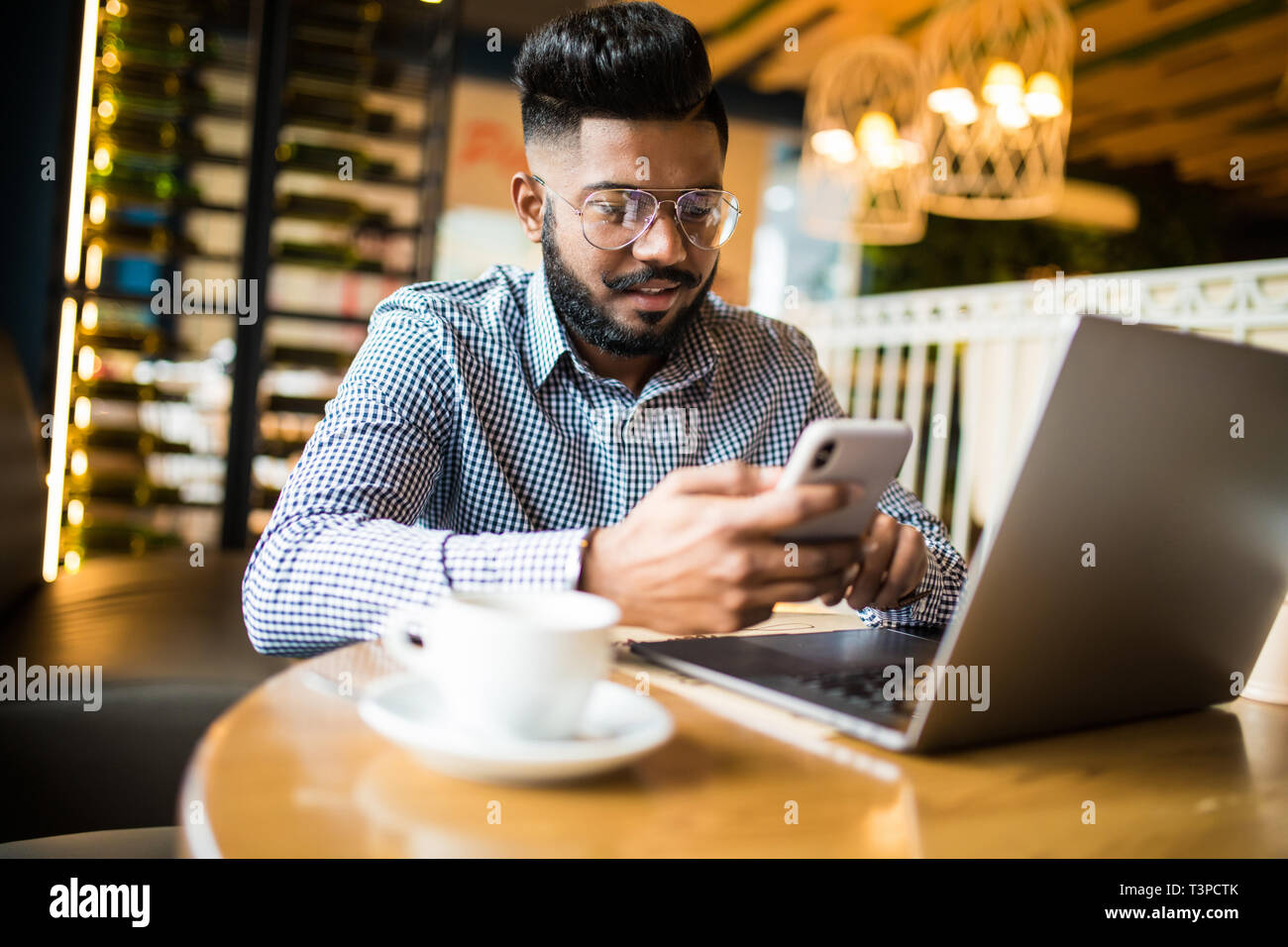 Portrait of indian man using laptop computer at workplace Stock Photo ...