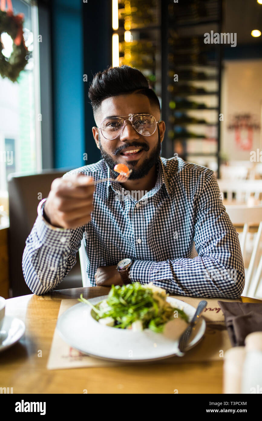 Handsome man eating beard fork hi-res stock photography and images - Alamy