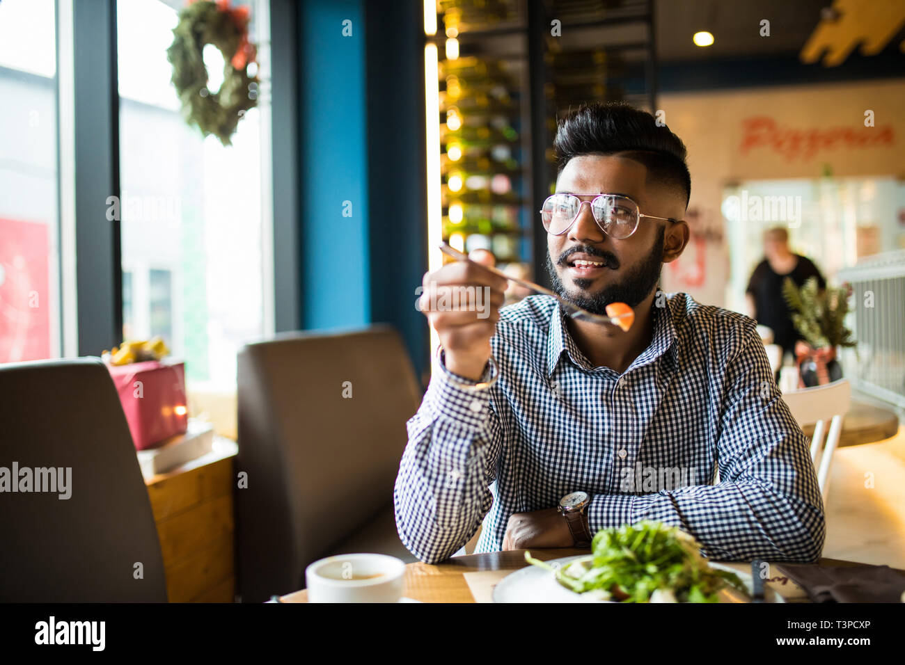 Handsome man eating beard fork hi-res stock photography and images - Alamy