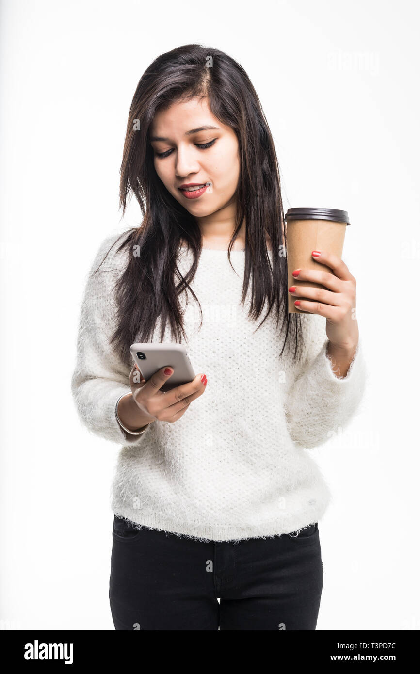Indian woman texting message with smartphone, isolated on white ...
