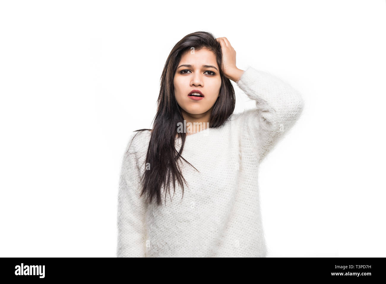Closeup portrait of confused young indian woman placing hand on head ...