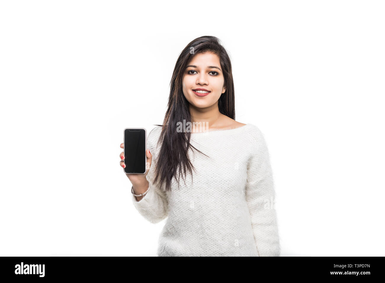Young Indian girl hold mobile phone screen for copy space isolated on a ...