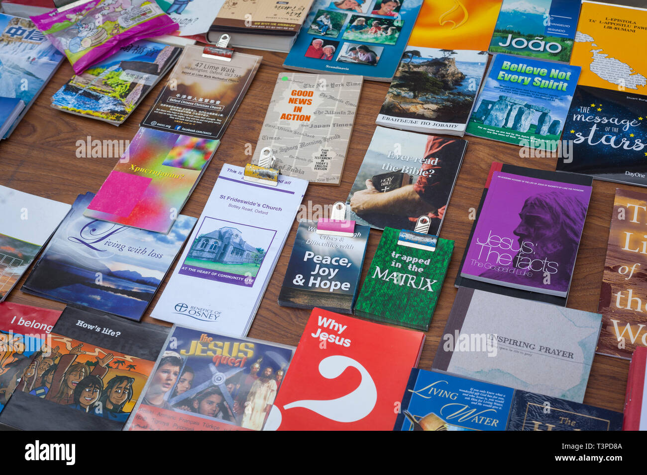 A table with an assortment of religious pamphlets and books Stock Photo ...