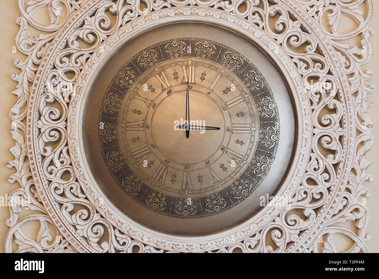 Vintage retro style clock on a wall Stock Photo - Alamy