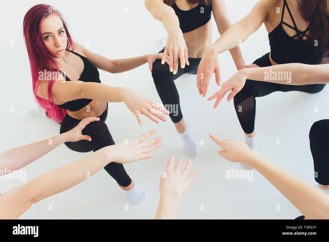 Horizontal close up photo young people girls and guys hold stack hands ...