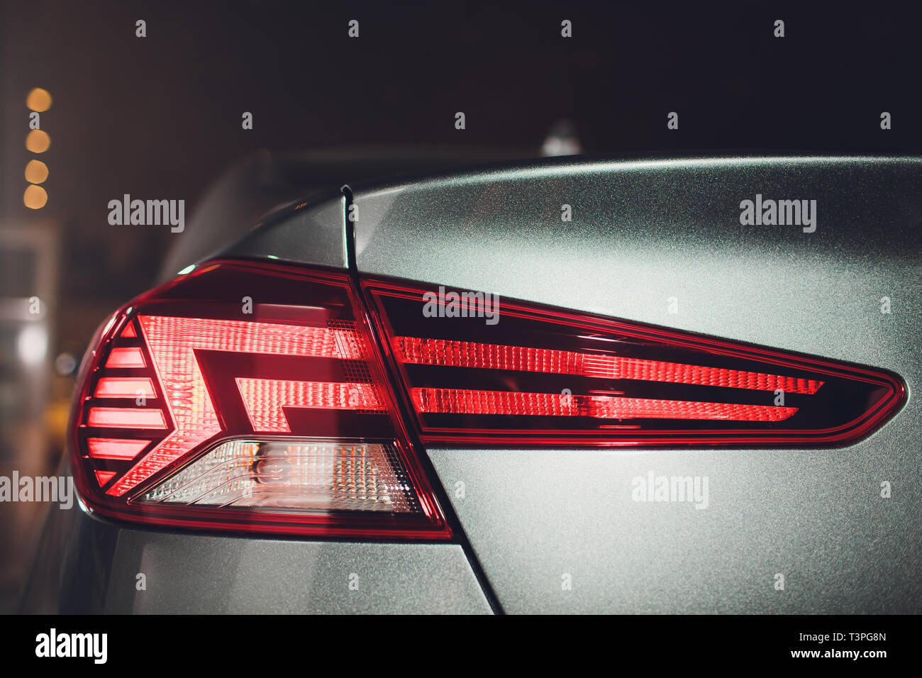 The rear lights of a modern prestigious car from a close angle, the ...