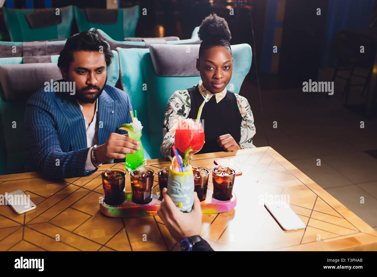 Group of friends drinking cocktails fashion bar restaurants - Side view ...