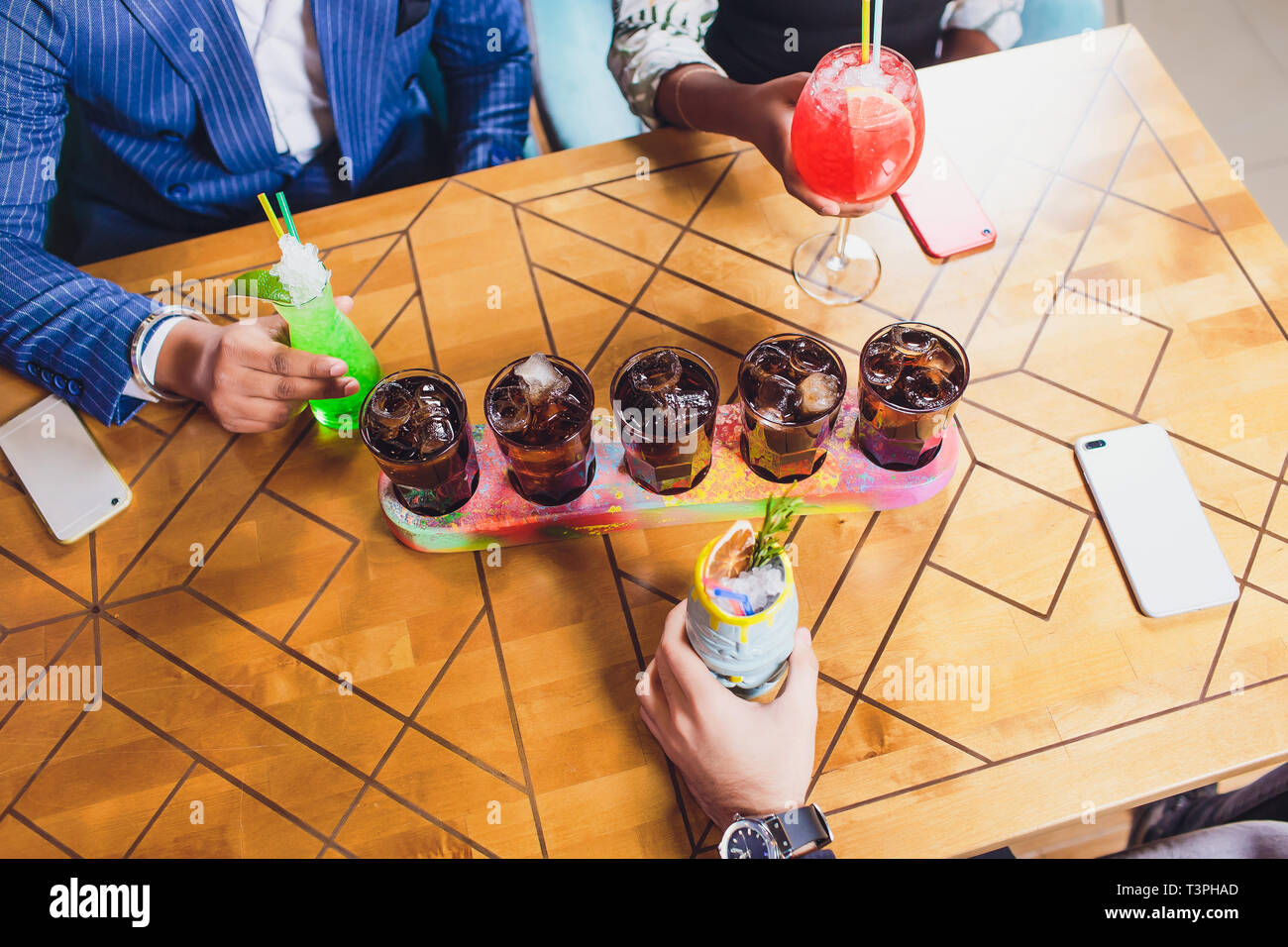 Group of friends drinking cocktails fashion bar restaurants - Side view ...