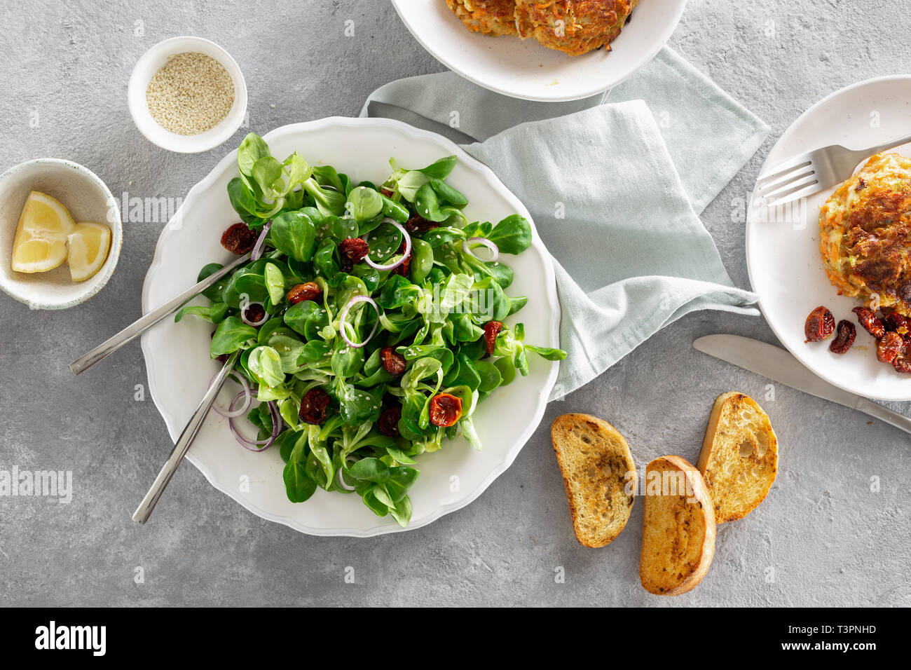 Healthy food concept. Vegetarian dinner table with green salad and ...