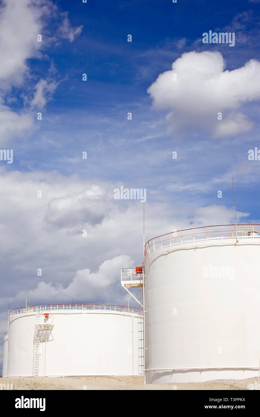 White oil reservoir. Oil and gas refinery plant. Industrial scene of ...