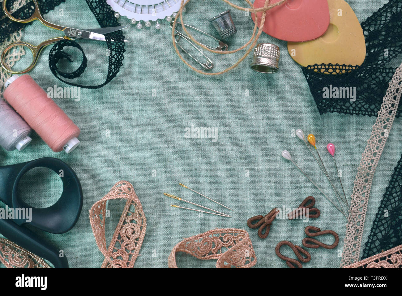 Sewing scene table flat lay composition. Threads, lace, pins, scissors ...