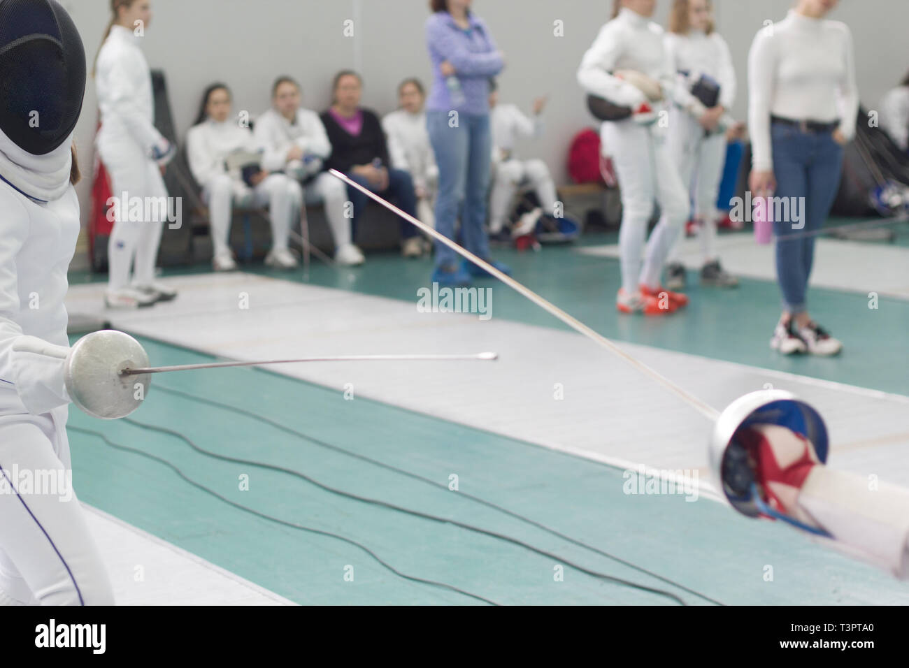 Two young person fencers practicing fencing duel Stock Photo - Alamy