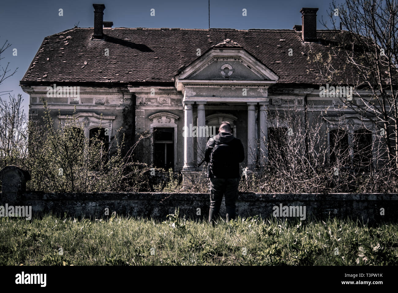 Man taking pictures in location with camera and exploring abounded ...